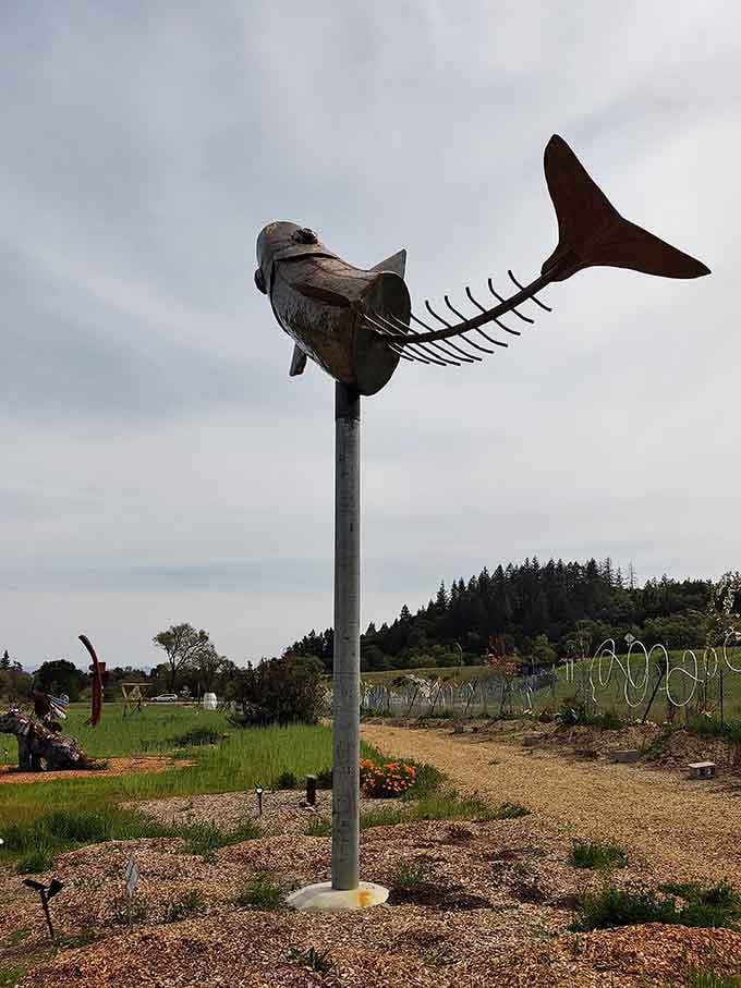 This airborne fish sculpture proves that even metal creatures dream of swimming through clouds instead of water.