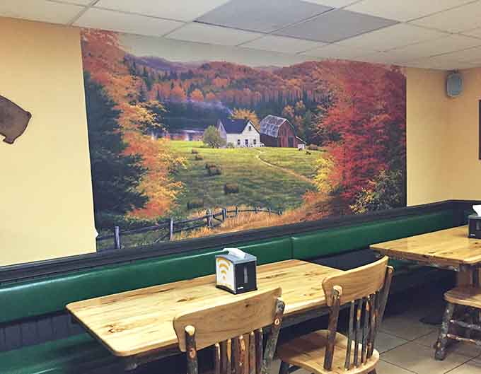 A pastoral mural provides peaceful scenery while you contemplate ordering another rack of ribs for the road.