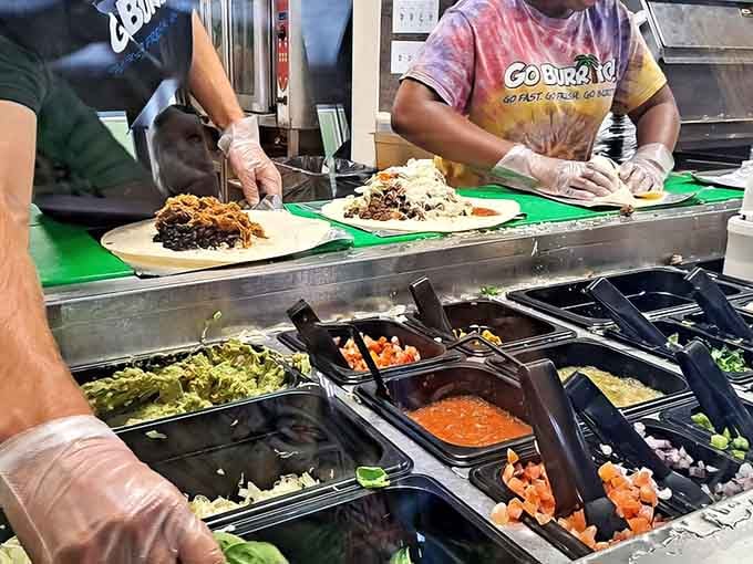 Watch the assembly line magic happen as your meal takes shape before your hungry eyes.