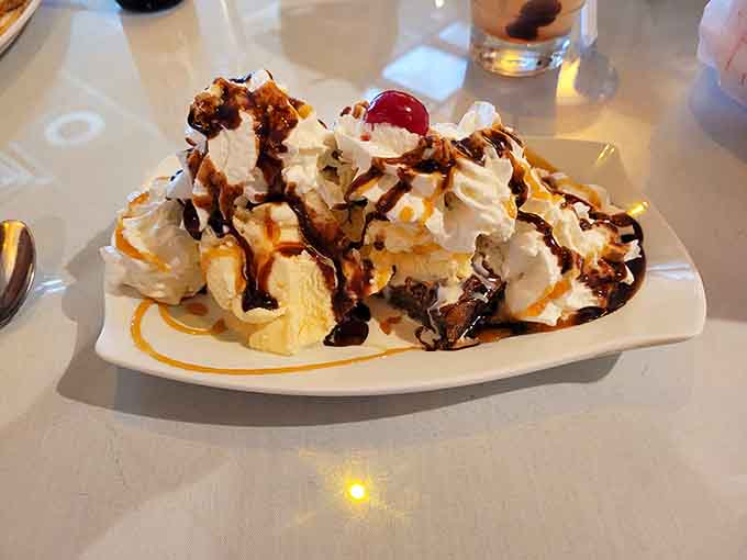 Ice cream sundae drizzled with chocolate and caramel, because ghosts aren't the only spirits worth celebrating here.