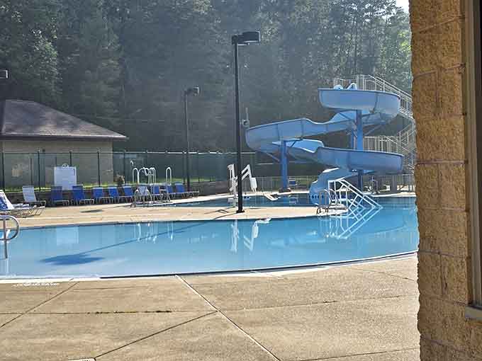 The pool's water slide catches morning light, ready to cool you down after hiking worked you up.