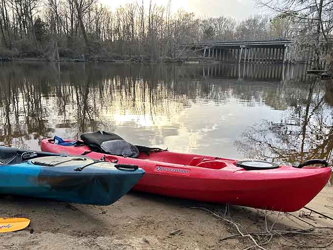 The Tar River provides peaceful waterfront access where kayaks wait patiently for their next adventure.