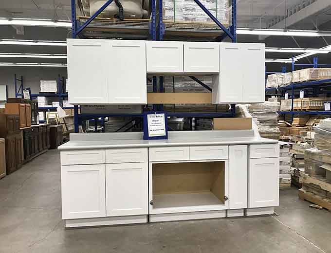 Pristine white kitchen cabinets proving that dream kitchens don't always require taking out a second mortgage.