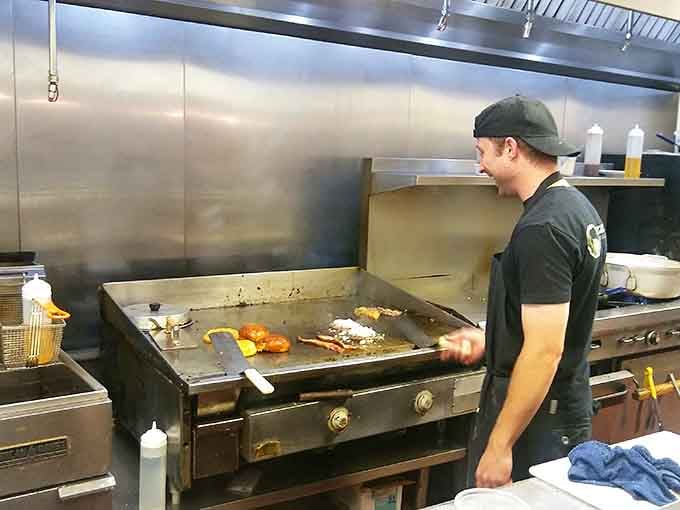 The open kitchen lets you watch the magic happen as skilled cooks work the griddle with impressive precision and care.