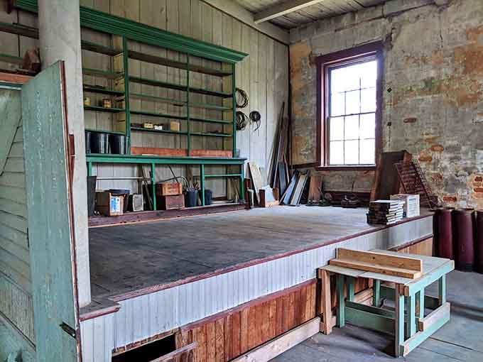 The old workshop area still holds shelves and tools, as if the craftsmen just stepped out for lunch.