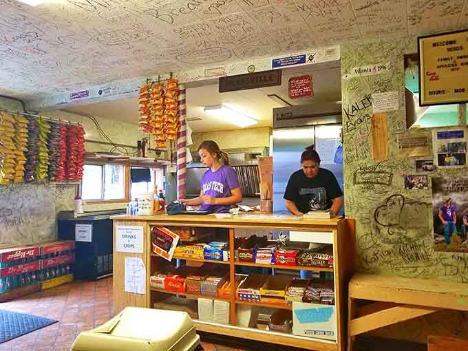 That counter stocked with candy bars and chips while burgers sizzle nearby is small-town America at its finest.