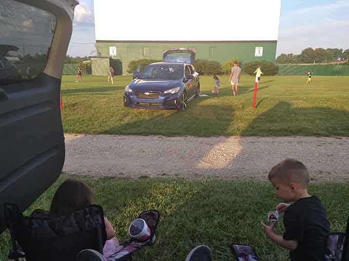 Families stake their claim on the perfect spot, chairs out and ready for the show to begin.