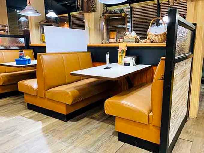 Clean booths with warm lighting invite you to settle in and make yourself comfortable for the long haul.