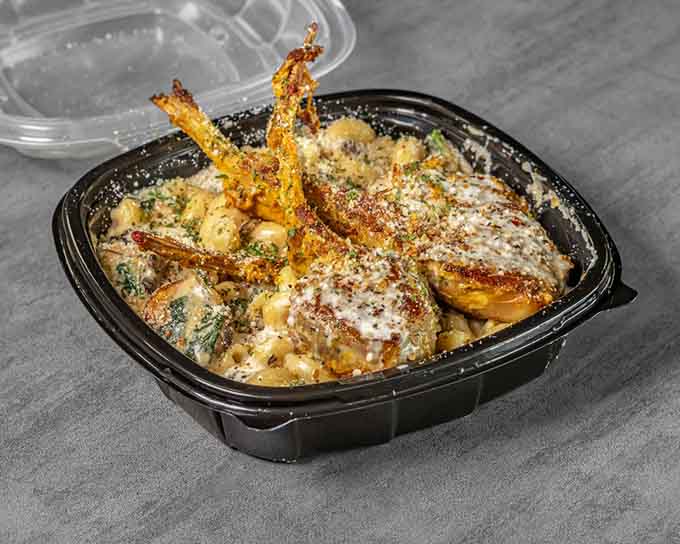 Creamy alfredo sauce blankets tender lamb chops and pasta, comfort food elevated to an art form.