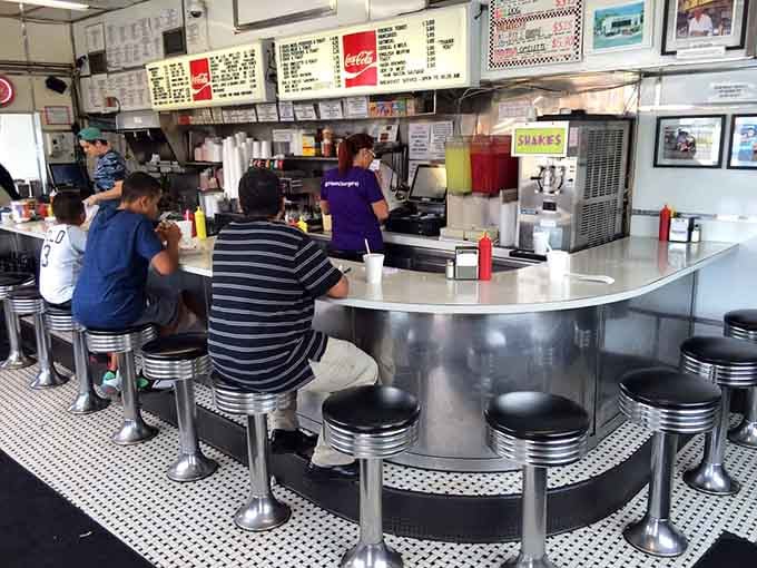 The curved counter where strangers become friends, united by their love of exceptional sliders.