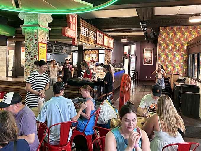 The dining room buzzes with the kind of energy that only comes from people eating really, really good pizza.