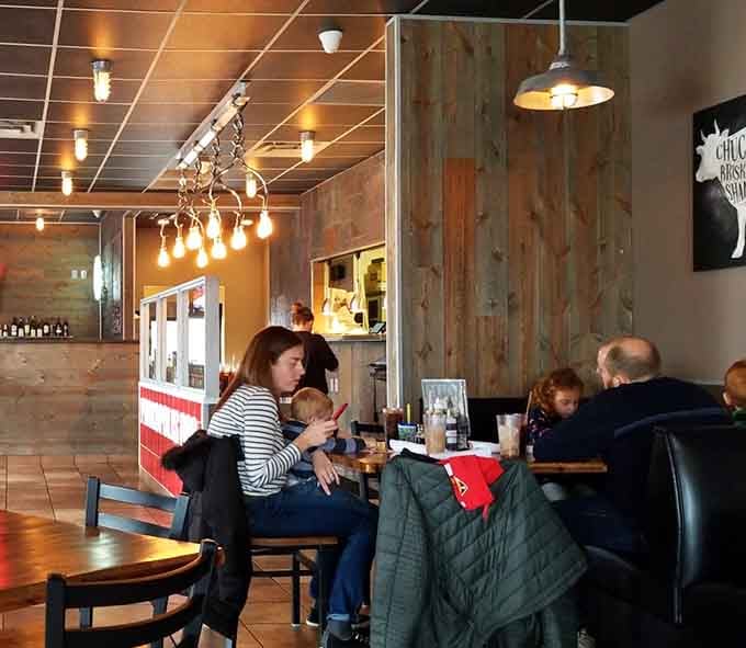 Real people enjoying real barbecue in a real neighborhood spot, exactly as it should be every single day.