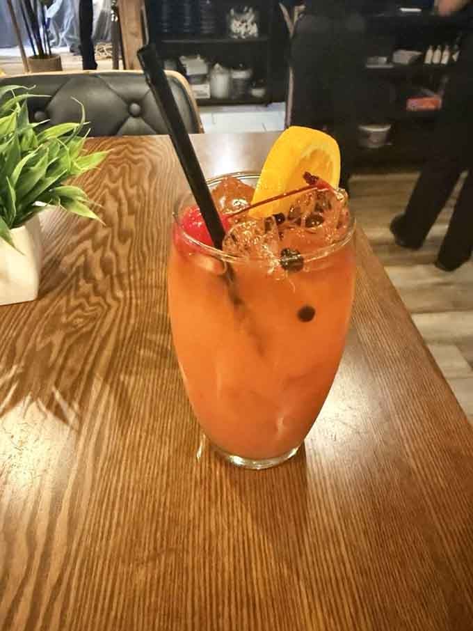 Rum punch garnished with island flair, making happy hour feel like a proper Caribbean celebration.