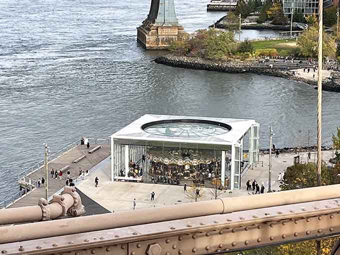 From above, the carousel looks like a jewel box someone carefully positioned for the best possible river views.