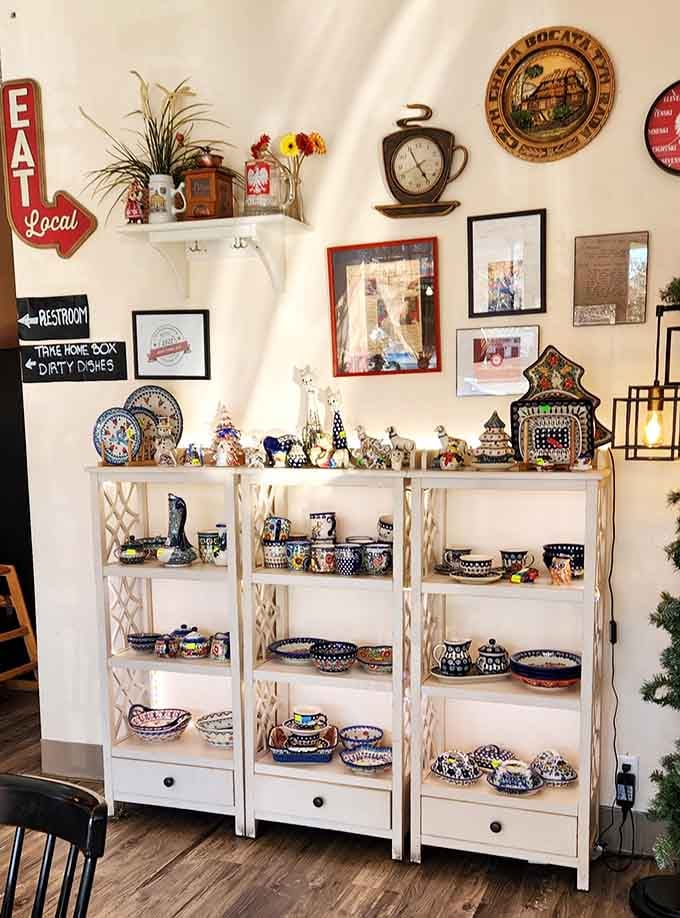 White shelving displays Polish treasures and decorative plates that make you feel like you're visiting someone's welcoming home.
