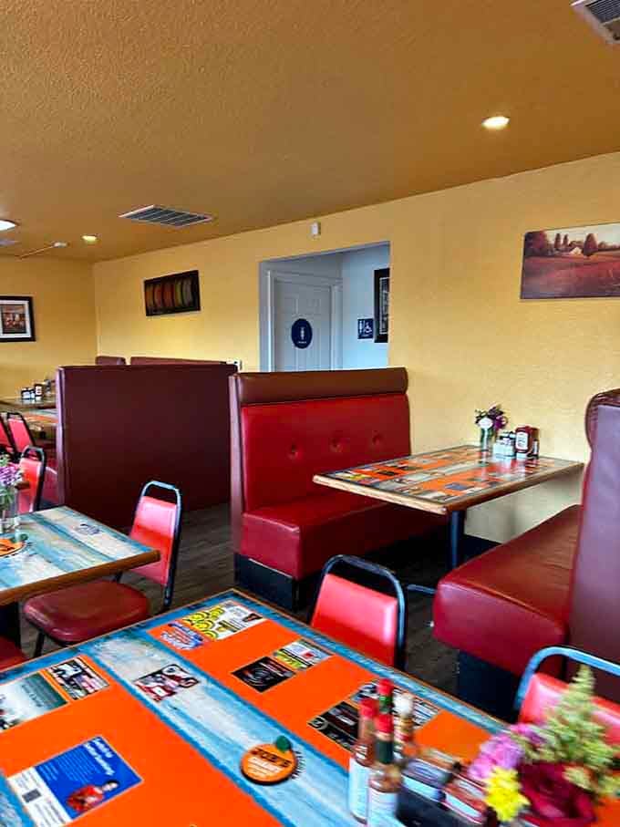 Cozy booths and colorful tables invite you to sit down, relax, and enjoy a proper meal.