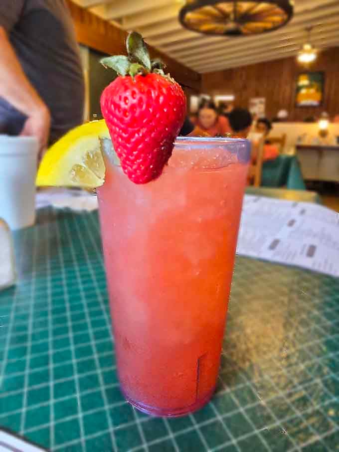 Fresh strawberry lemonade garnished like a tropical vacation, because even breakfast drinks deserve to look fancy.