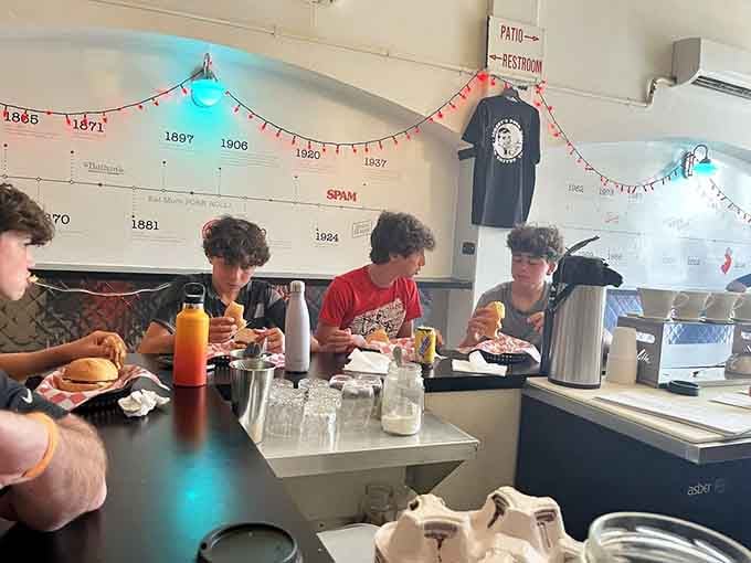 The counter where locals gather, eat, and silently judge anyone who orders their pork roll without cheese.
