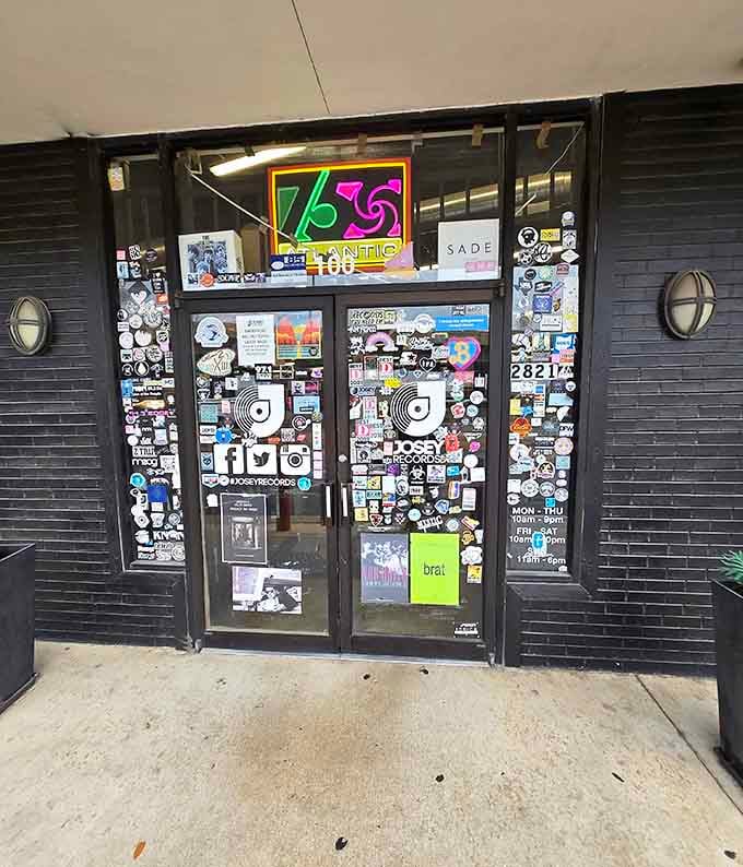 The entrance covered in stickers tells you everything about the music-obsessed souls who gather here regularly.