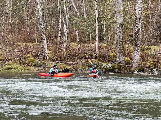 Kayakers navigating the Green River like they're auditioning for an outdoor adventure commercial. Spoiler: they're just having fun.