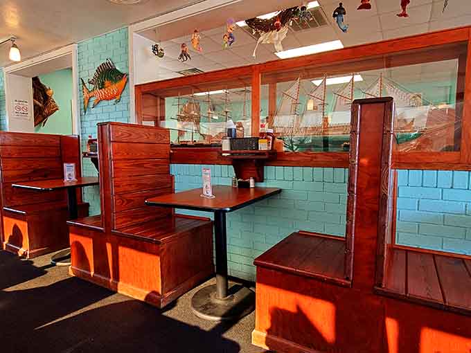 Booth seating with turquoise walls and nautical vibes, where every meal feels like a mini beach vacation.