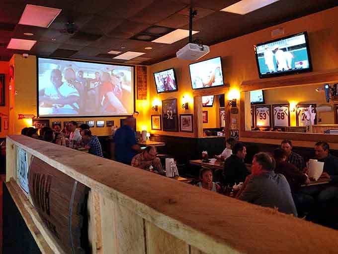 A packed house of happy diners watching the game proves that great barbecue brings people together better than any social media app.