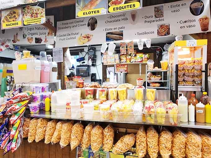 Elotes and esquites beckon from food stalls where authentic flavors prove the best meals don't need fancy dining rooms.