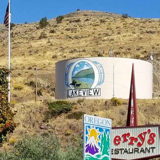 The town water tank proudly displays Lakeview's identity against hills that define this high desert landscape.
