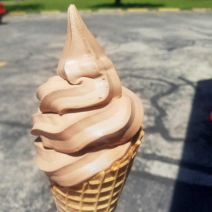 Perfect swirls of chocolate soft serve in a waffle cone represent everything right about summer in Wisconsin, pure and simple.