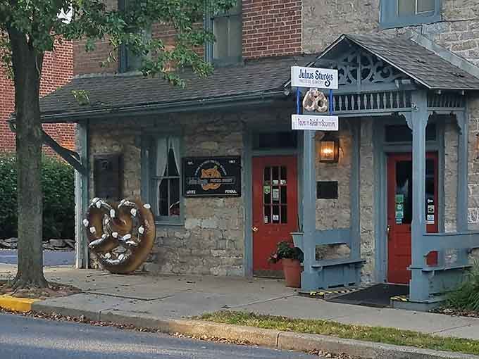 The pretzel bakery's stone facade promises authentic twisted goodness that's been perfected over generations of dedicated bakers.