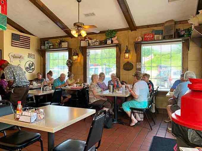 Happy diners fill the cozy space, enjoying generous portions in an atmosphere that feels like coming home.
