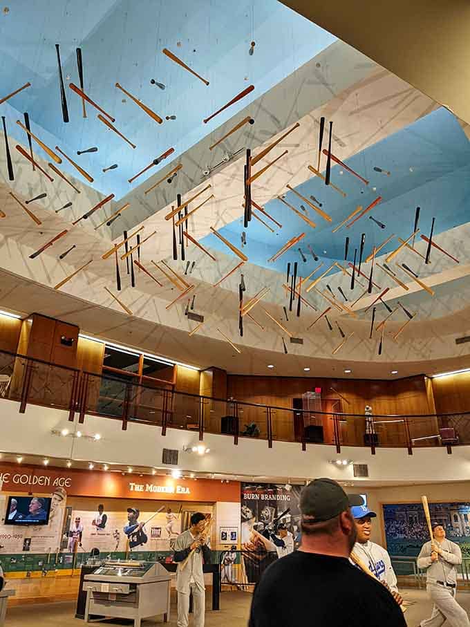 Bats suspended from the ceiling create an artistic installation that's part museum display, part fever dream for baseball enthusiasts everywhere.
