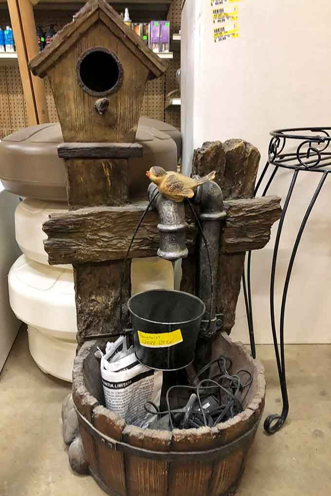 Rustic water fountains with birdhouses prove that yard art can be both charming and delightfully over the top.