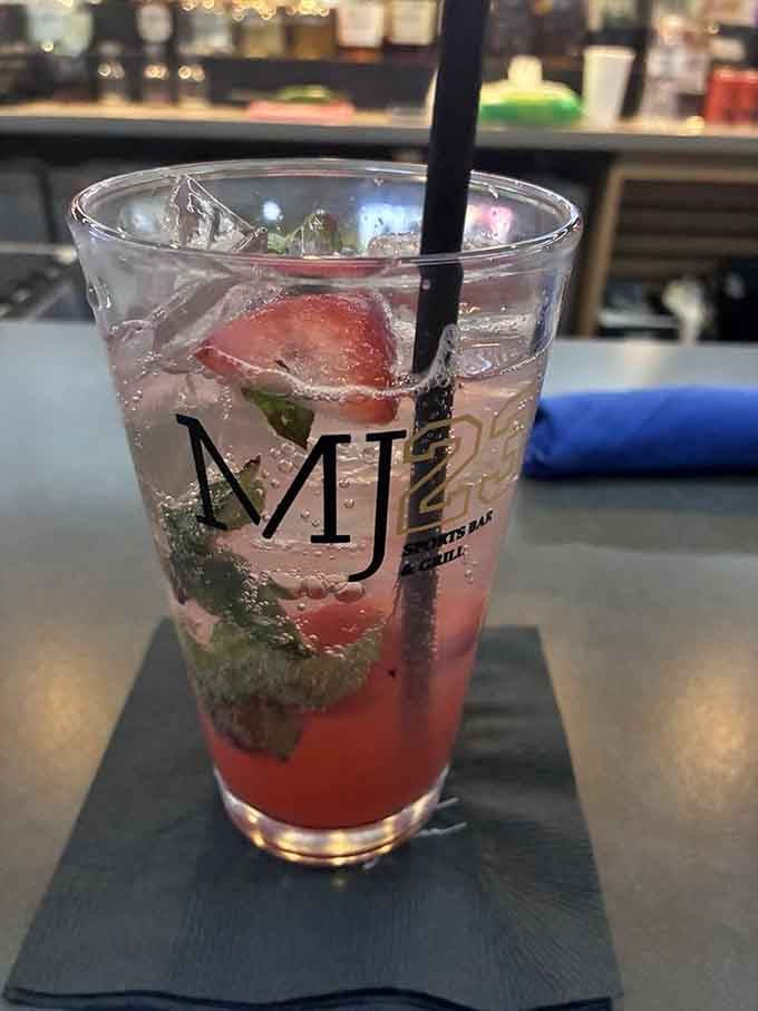 The MJ23 branded glass holds a fruity concoction with muddled strawberries that screams summer refreshment regardless of the actual season outside.