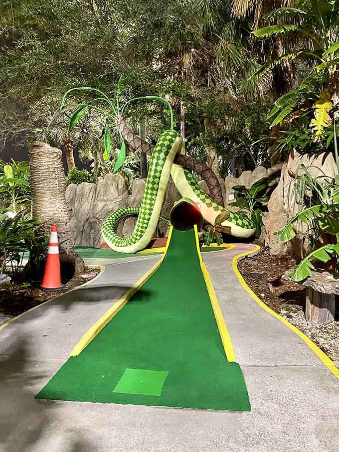 A bright green serpent lurking on the course, judging your putting technique with those unblinking reptilian eyes.