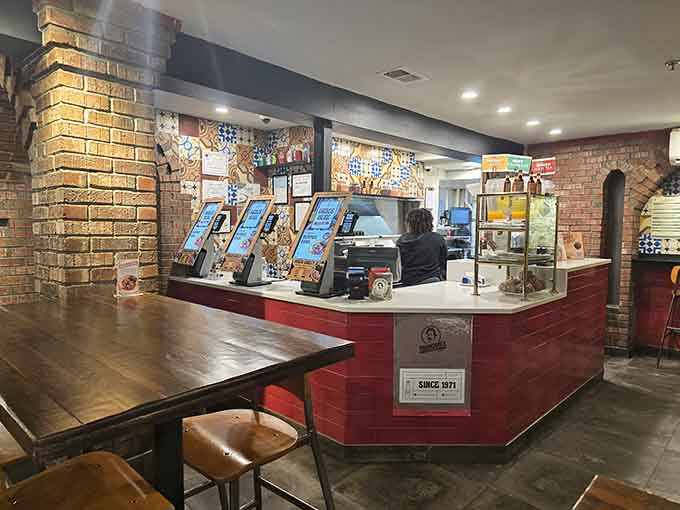 Colorful tile work and modern ordering screens blend tradition with convenience at this welcoming counter space.