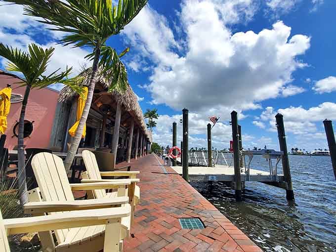 Waterfront dining with Adirondack chairs positioned perfectly for contemplating life's important questions, like "more seafood?"