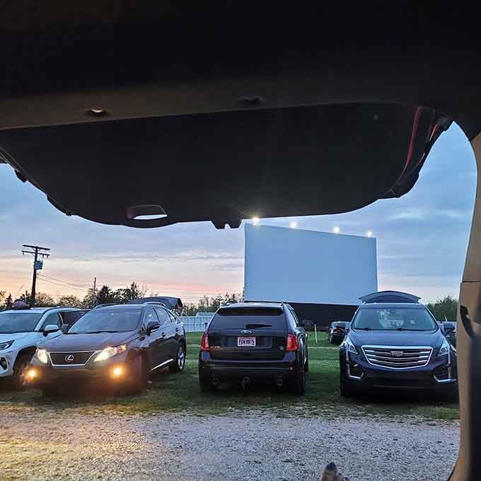 Luxury vehicles lined up like it's premiere night, because drive-ins welcome everyone from sedans to SUVs.