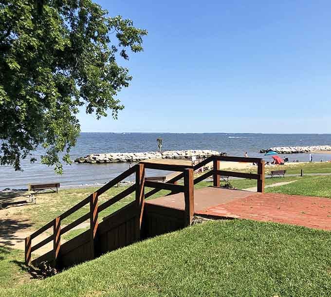 Wooden stairs leading to the beach mean easy access without the sand-in-your-shoes struggle before you arrive.