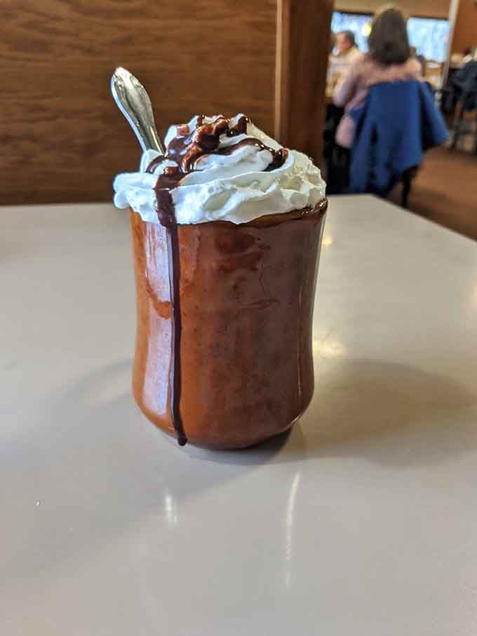 Hot chocolate topped with whipped cream and drizzled with chocolate&mdash;because sometimes you need dessert before breakfast.