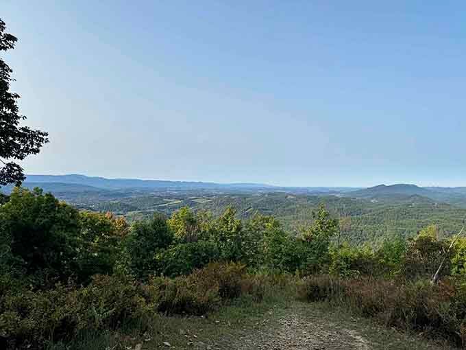 Lush green valleys spreading below like nature's own quilt, stitched together by ridges older than human memory itself.