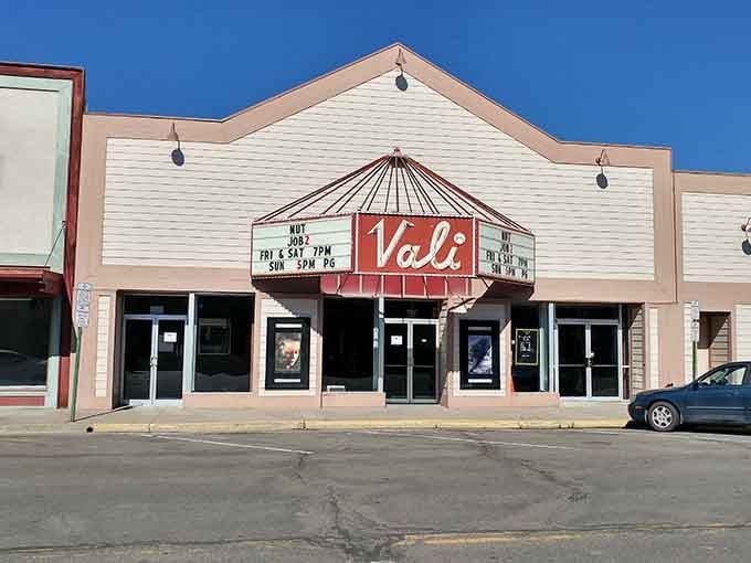 The classic movie theater marquee beckons with weekend showtimes, offering entertainment that won't cost a car payment.