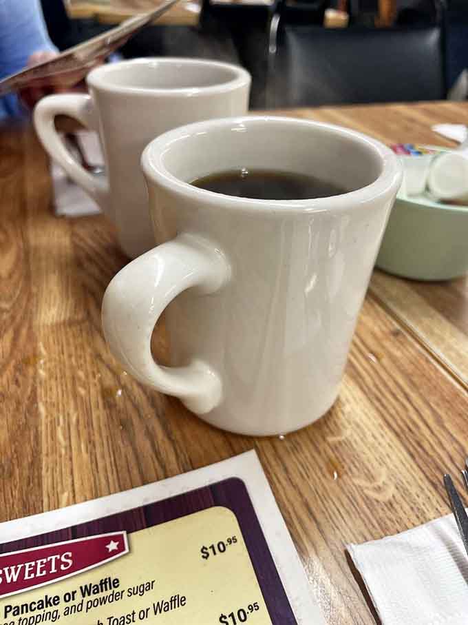 Hot coffee in classic diner mugs tastes better when you're about to tackle legendary pancakes.
