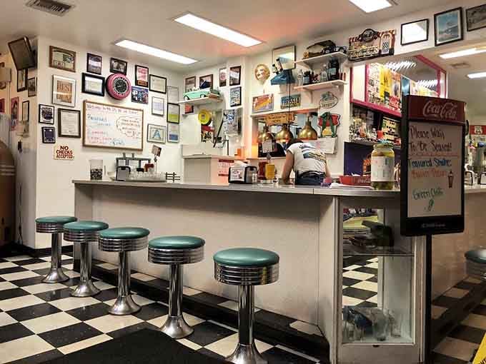 Chrome stools and checkered floors create the perfect stage for milkshake magic and timeless diner dreams.