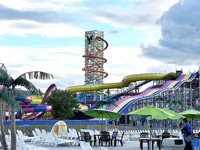 These colorful slides spiral skyward like a rainbow-hued tower of pure adrenaline and summer excitement combined.