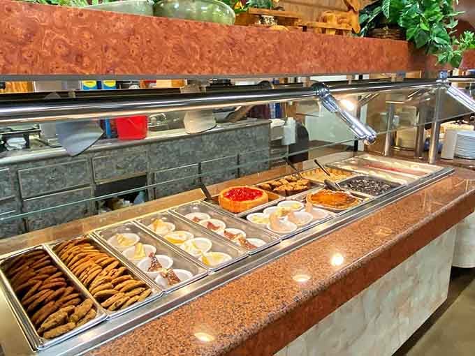 The dessert station gleams with sweet possibilities, from cookies to cobblers, each one calling your name louder than the last.