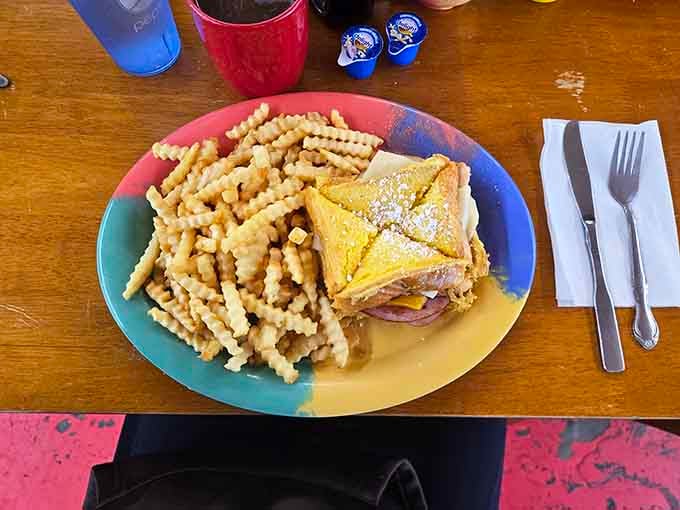 The Monte Cristo: where French toast meets sandwich in a powdered sugar love story that defies all breakfast conventions.