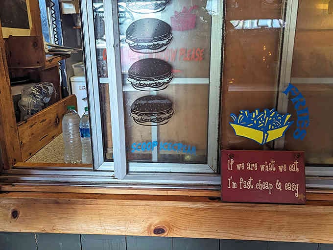 Burger illustrations on the glass and that perfect motto below remind you that fast, cheap, and easy beats fancy every time.