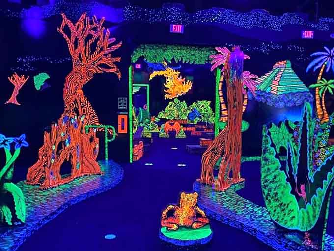 Glowing trees and mystical landscapes turn each hole into its own little fluorescent adventure story.