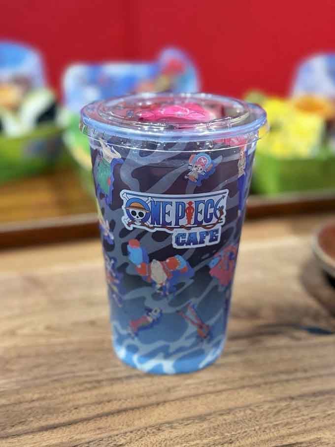 Robin's signature drink blooms with vibrant pink layers, as mysterious and beautiful as the archaeologist herself would approve.